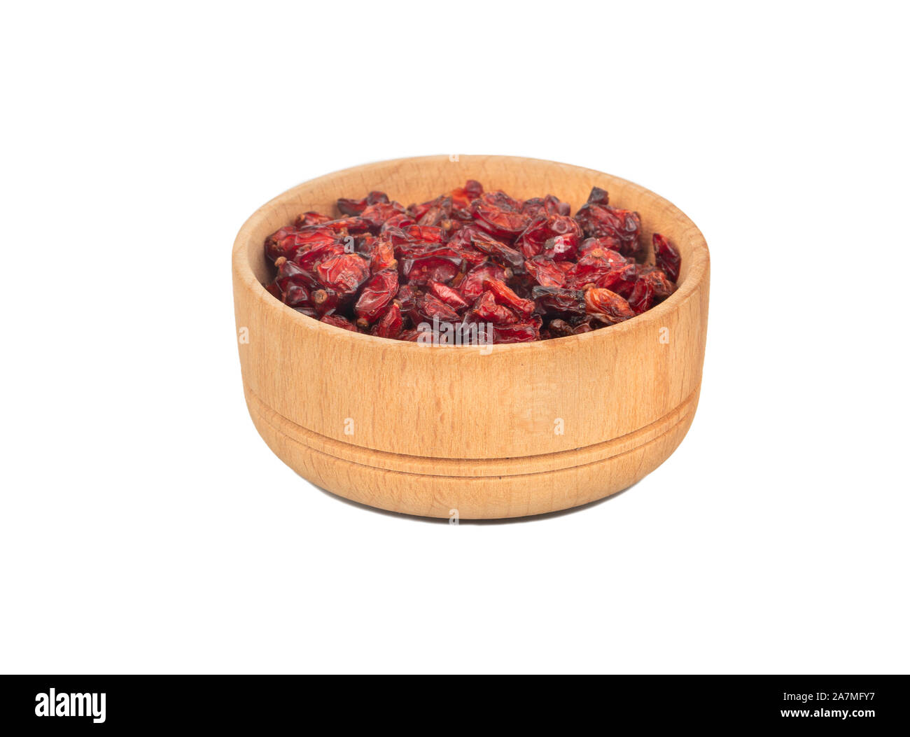 Dry barberry in wooden bowl on white background Stock Photo - Alamy