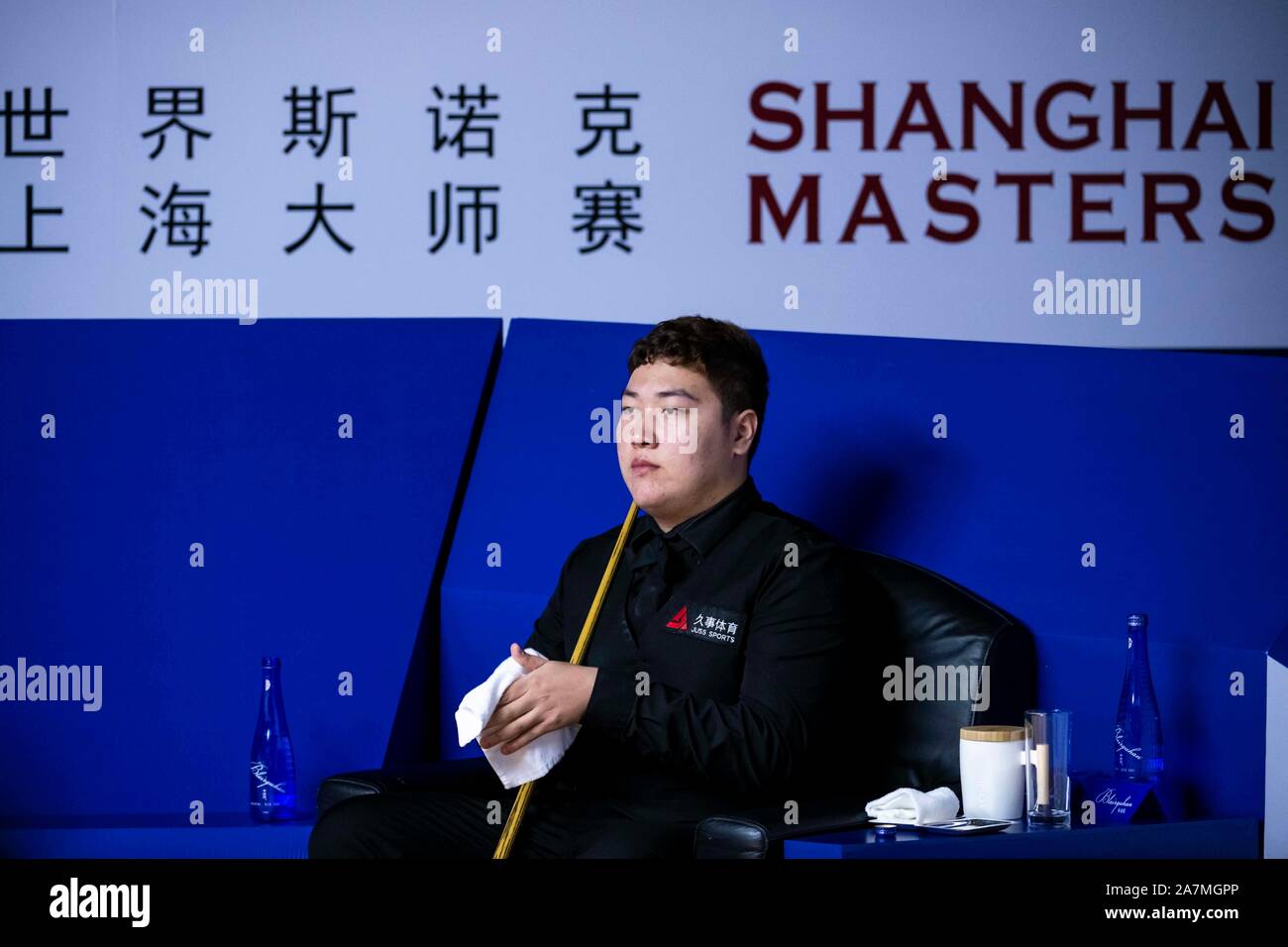 Chinese professional snooker player Yan Bintao rests at the Round 1 of ...