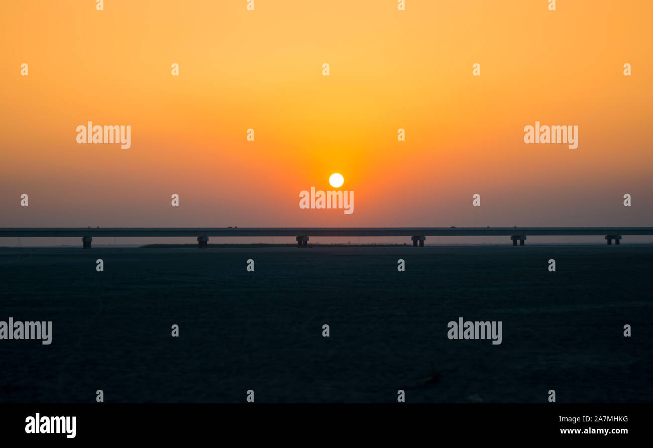 beautiful sunset on river bridge with orange background.landscape image ...
