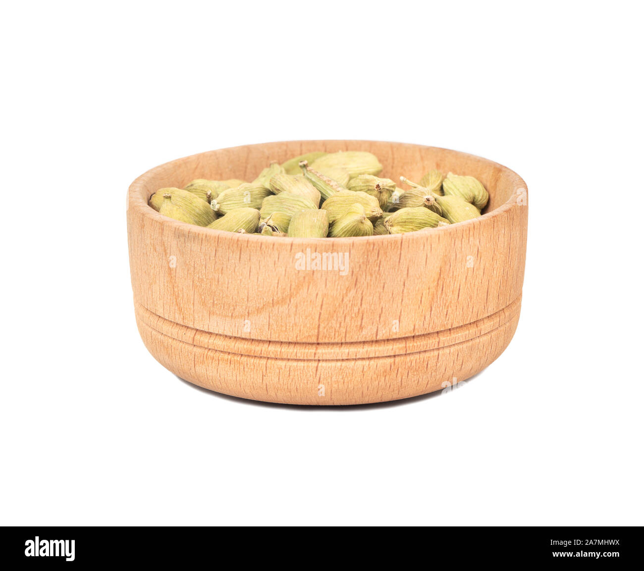 Dry cardamom in wooden bowl isolated on white background Stock Photo ...