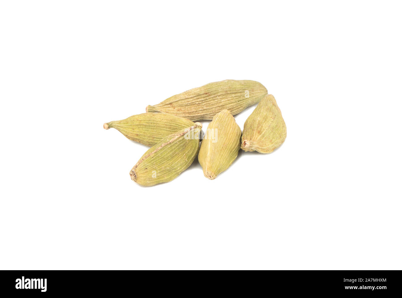 Several grains of dry cardamom on a white background Stock Photo - Alamy
