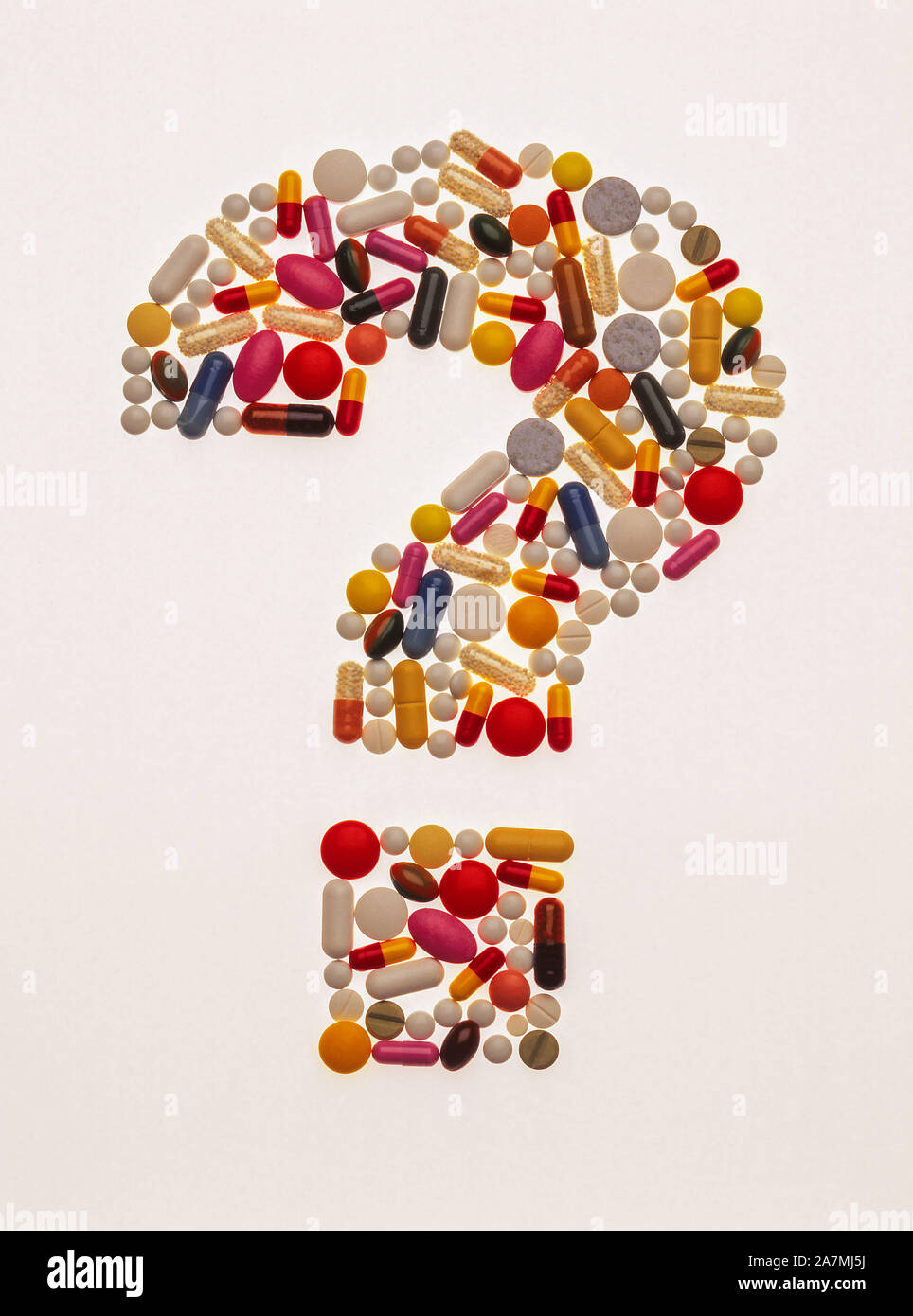Question mark made from many different colourful pills and capsules ...