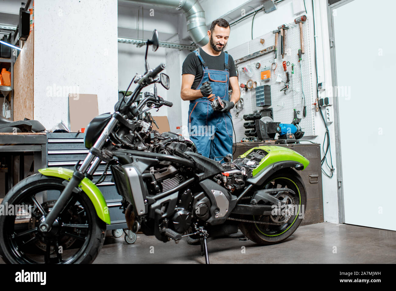 Mechanic working motorcycle workshop hi-res stock photography and ...