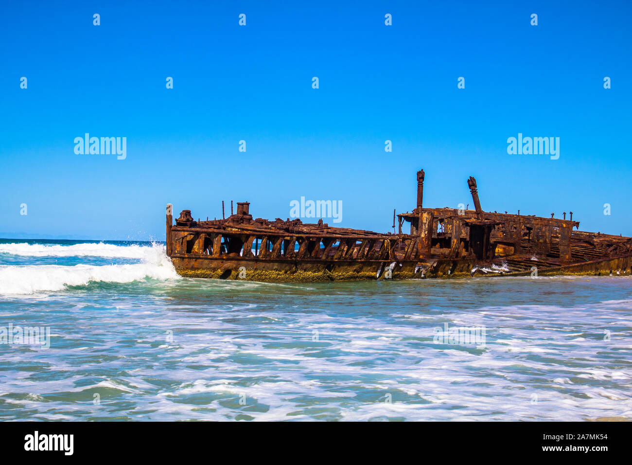 Photograph of the shipwreck of the SS Maheno on Fraser Island with a ...
