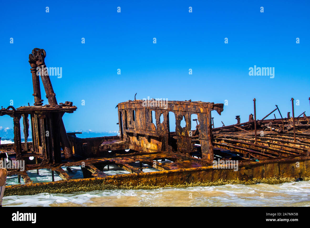 Photograph of the shipwreck of the SS Maheno on Fraser Island with a ...