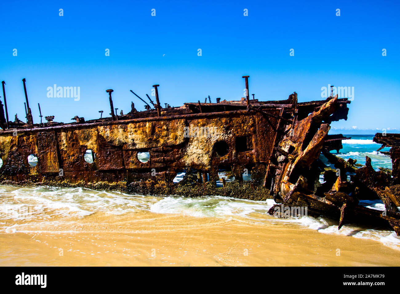 Photograph of the shipwreck of the SS Maheno on Fraser Island with a ...