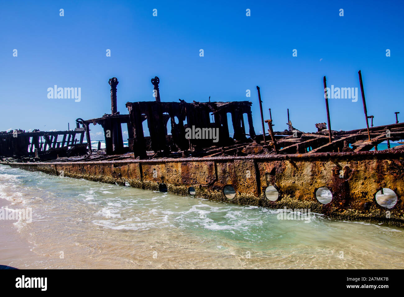 Photograph of the shipwreck of the SS Maheno on Fraser Island with a ...