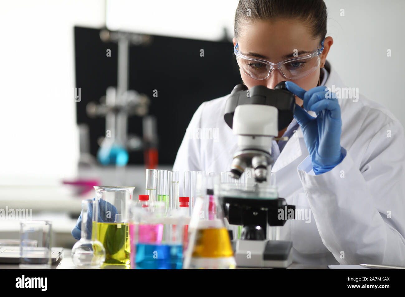 Adult caucasian beauty woman chemist in protective Stock Photo - Alamy