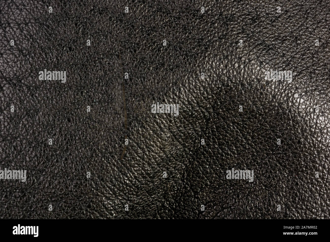 Old vintage genuine soft black leather texture background, top layer ...
