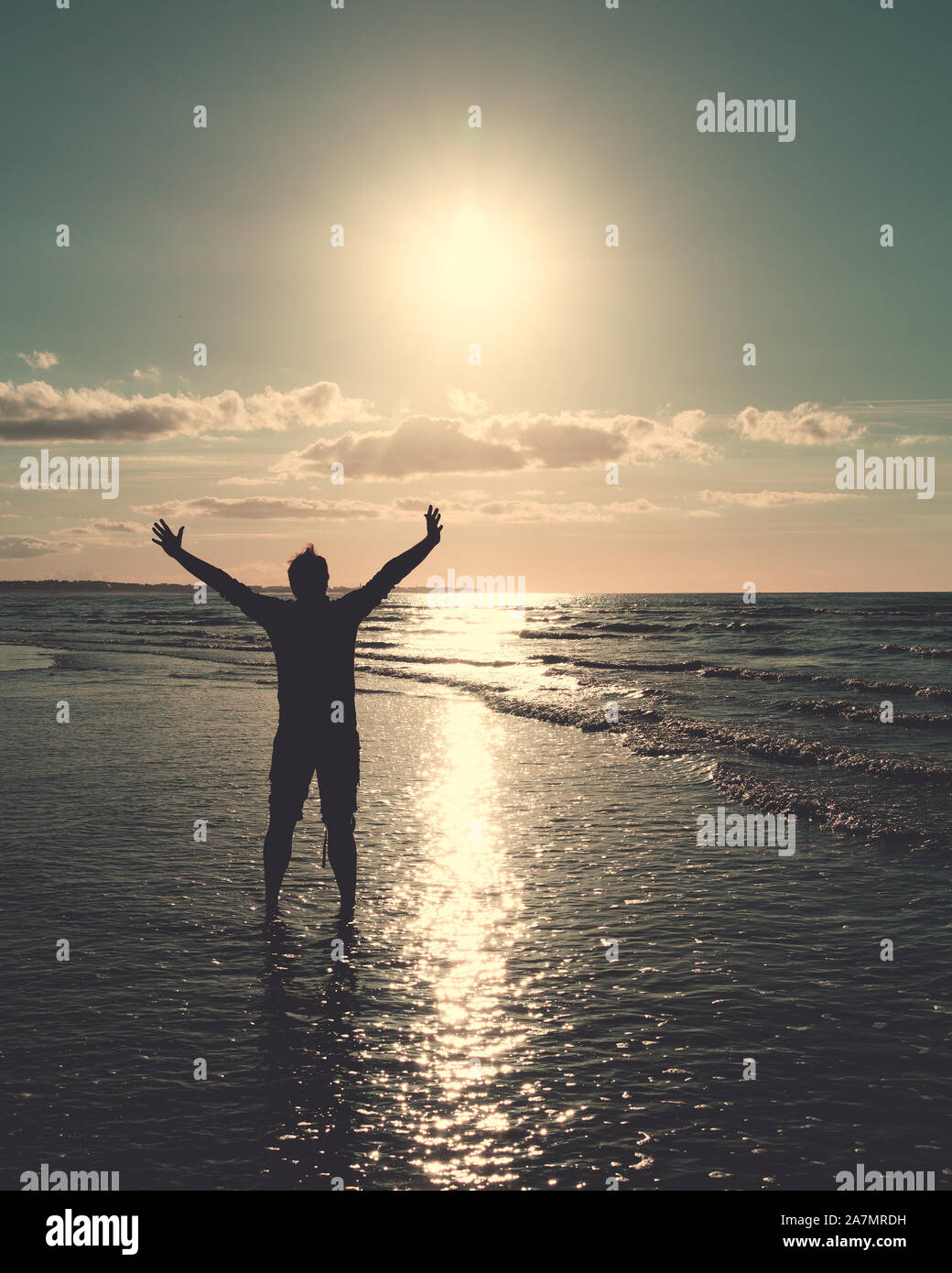 Man with arms open sun hi-res stock photography and images - Alamy