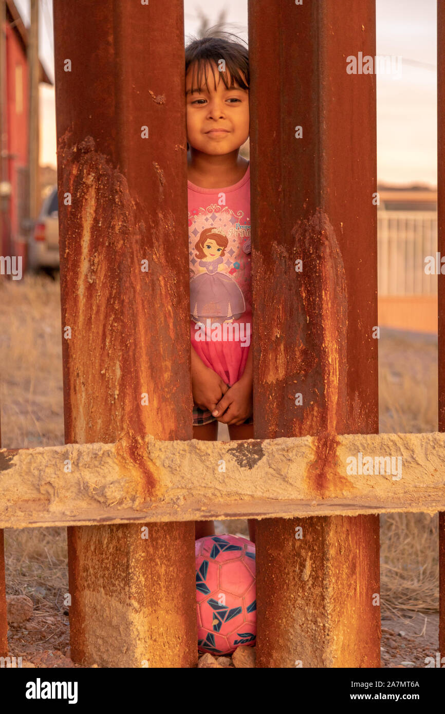 Children play on the Mexican side of the US Mexican border wall, Trump ...