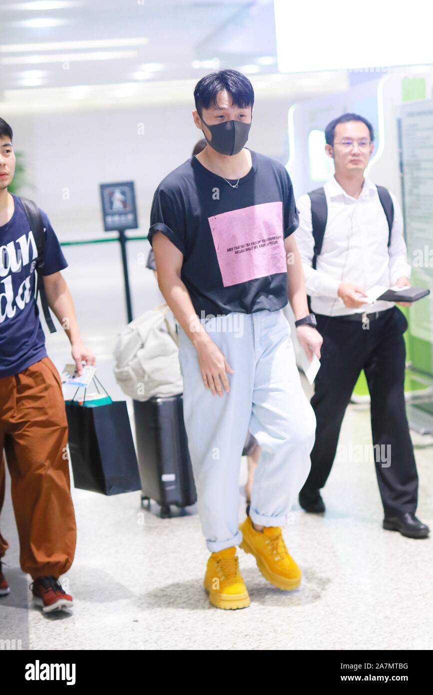 Chinese singer-songwriter and producer Li Ronghao, middle, arrives at ...