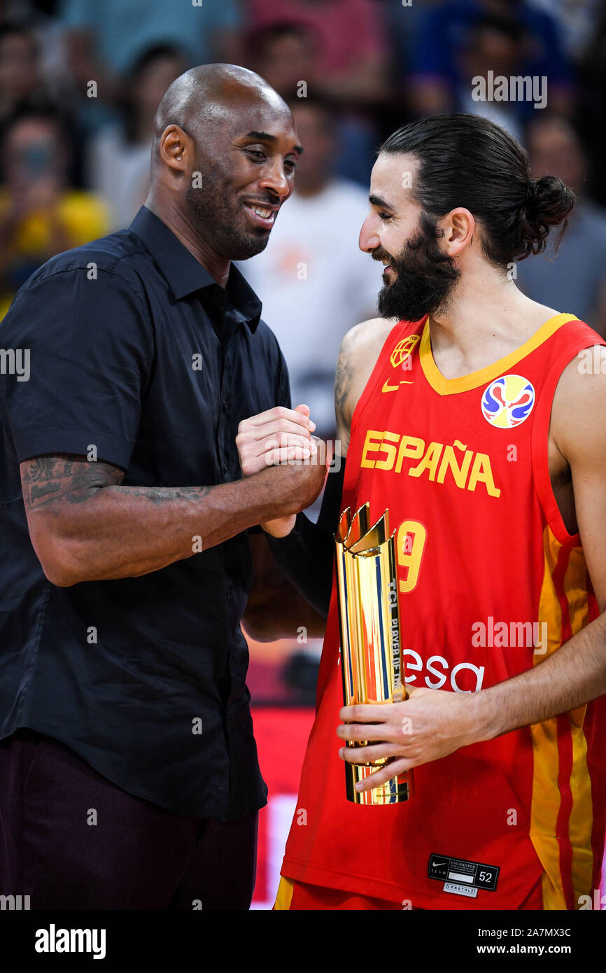 Retired American basketball player Kobe Bryant, left, awards the MVP ...
