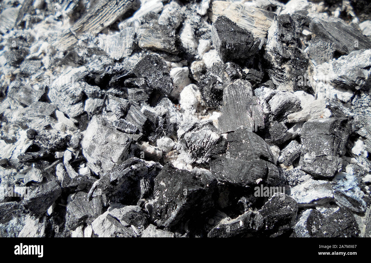 Beautiful red flame from slice wood, dark grey black coals inside metal ...