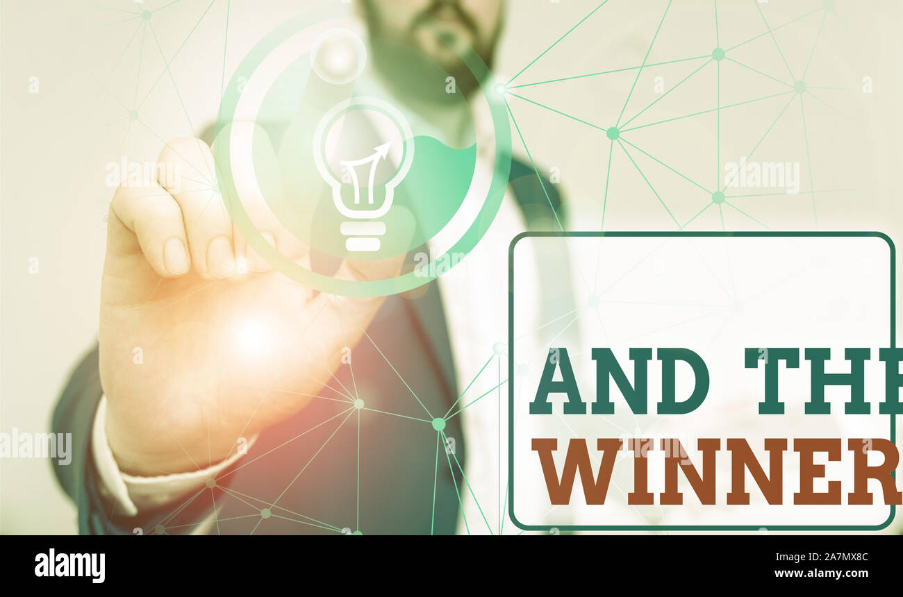 Writing note showing And The Winner Is. Business concept for announcing ...