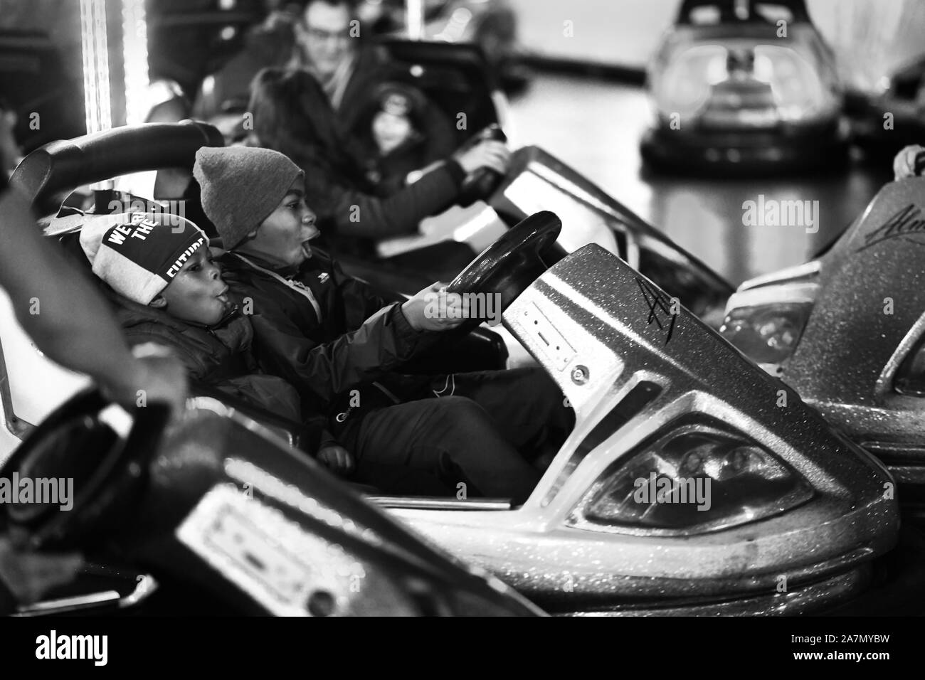 Fairground ride dodgem cars Britain Uk children kids enjoying ...