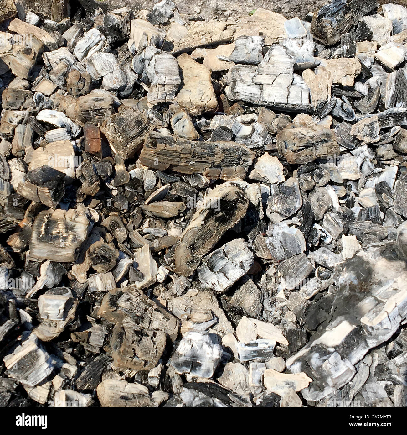 Beautiful red flame from slice wood, dark grey black coals inside metal ...