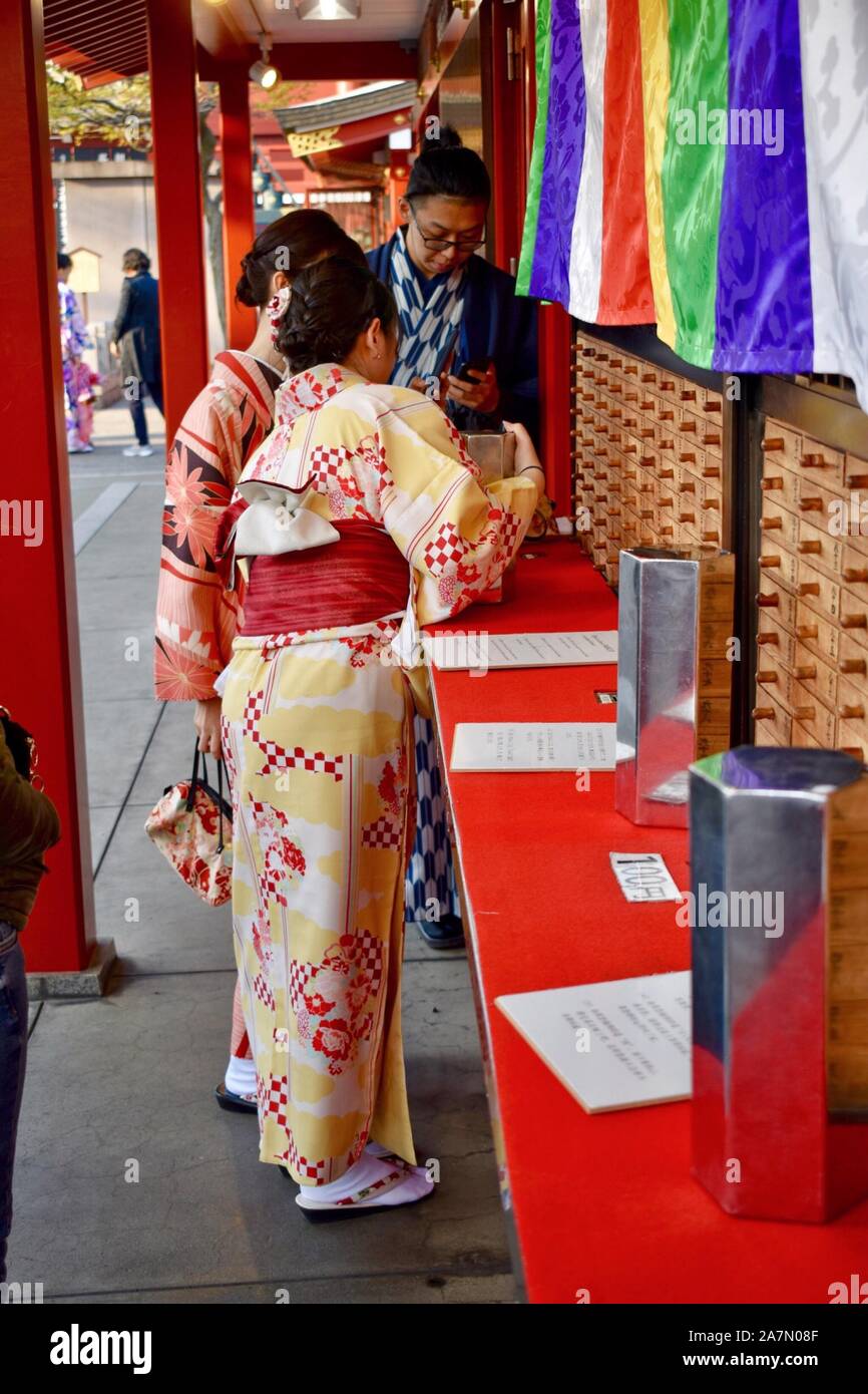 Girls and boy dressed in traditional Japanese dress with traditional ...