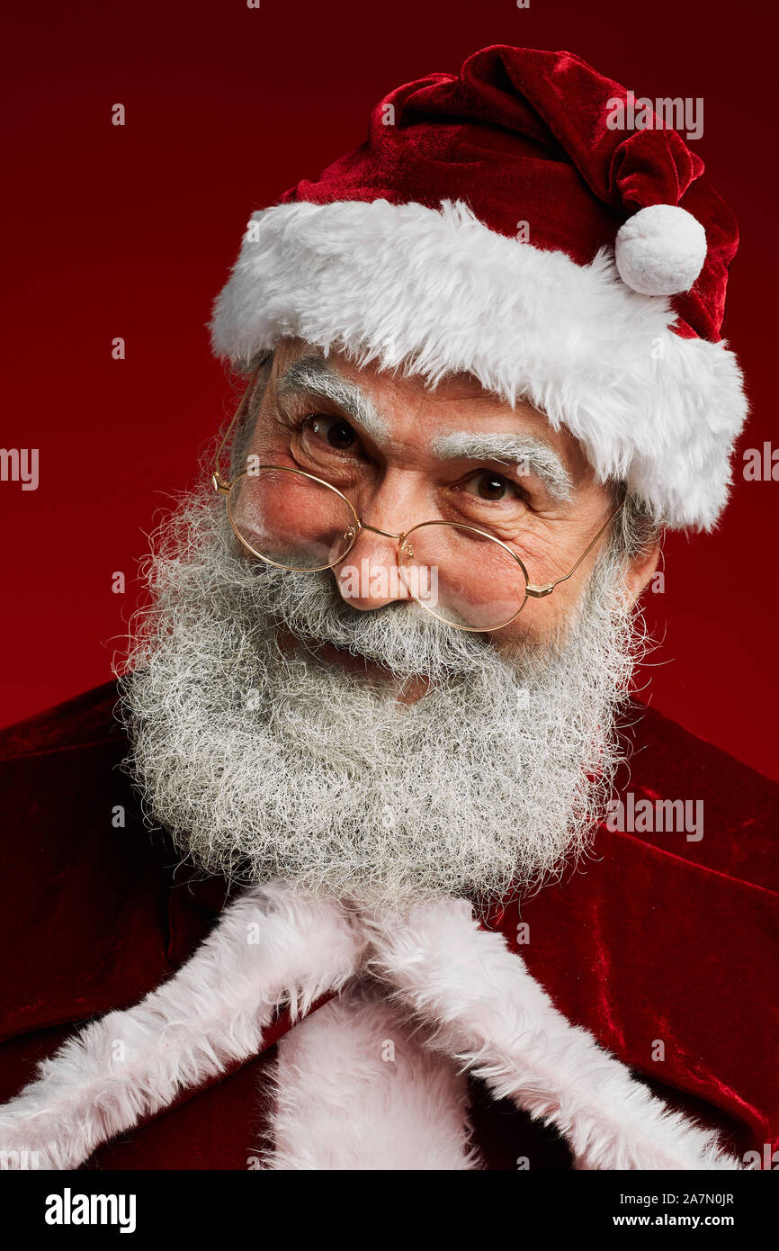 Head and shoulders portrait of fairytale Santa looking at camera kindly ...