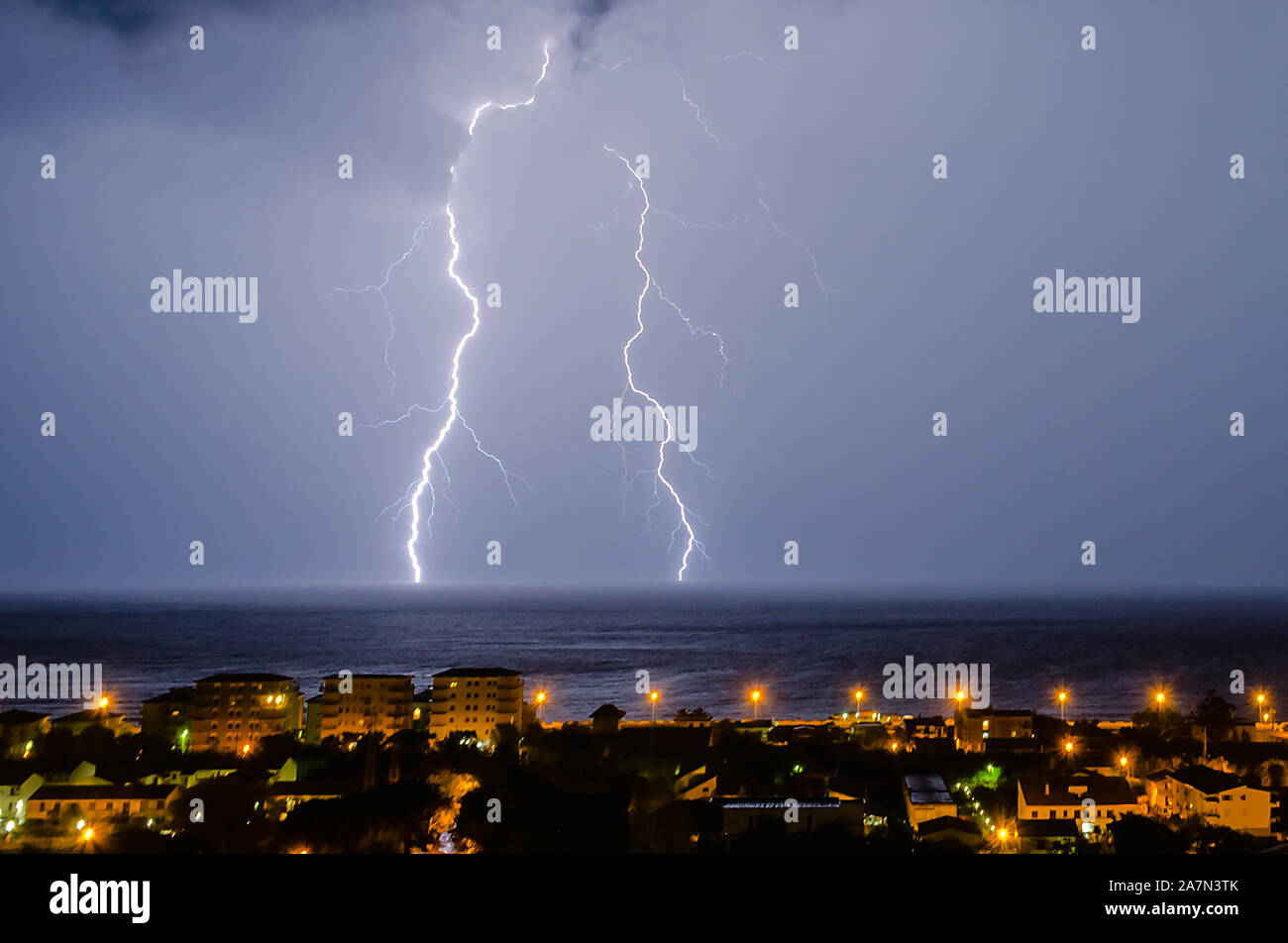 Lightning over the sea, night scene Stock Photo - Alamy