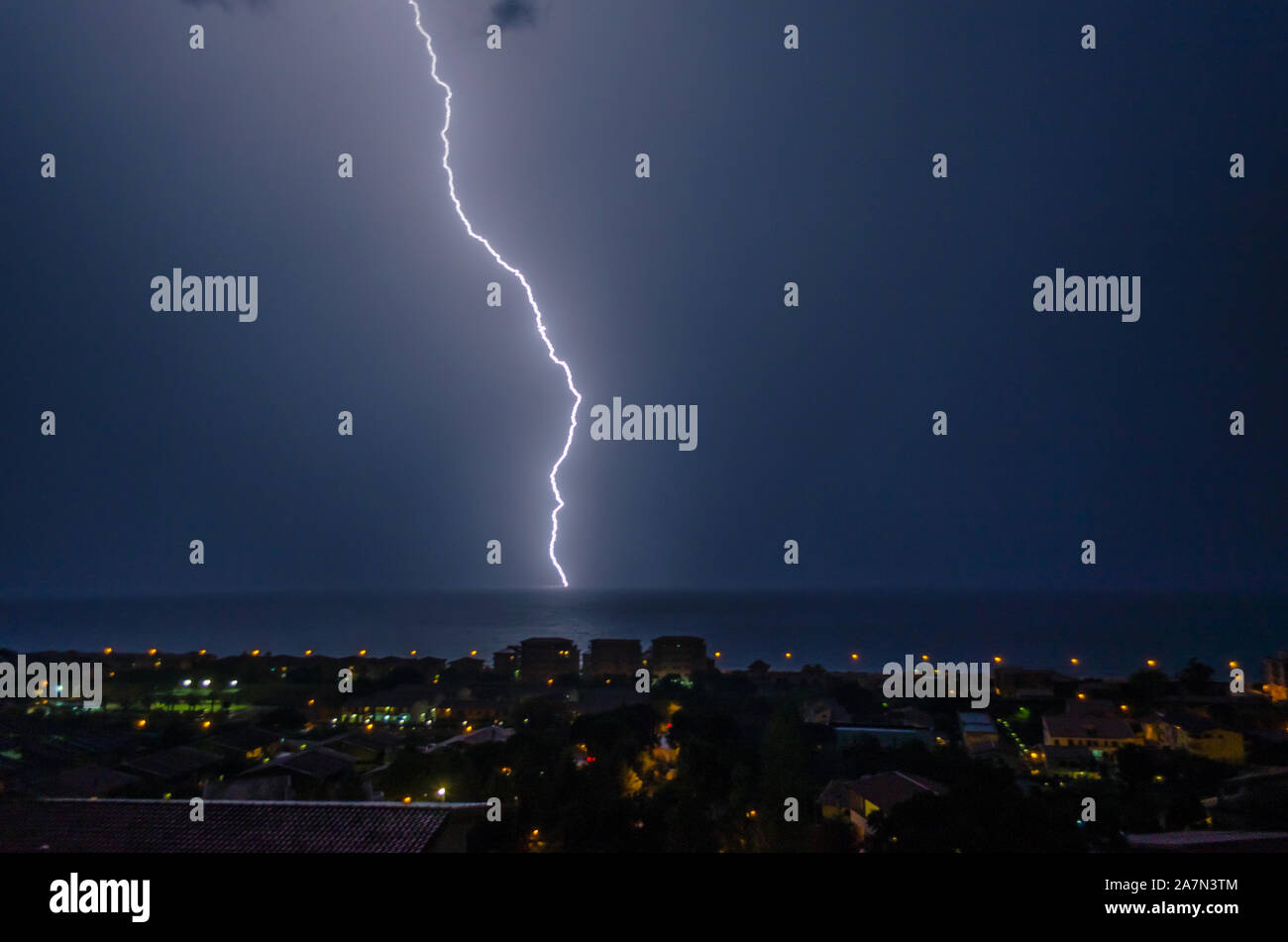 Lightning over the sea, night scene Stock Photo - Alamy