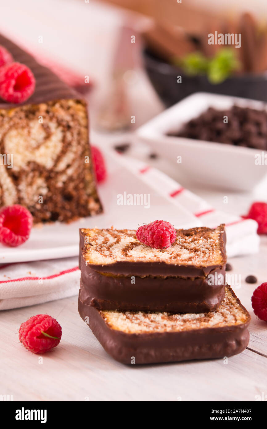 Marble cake with raspberries Stock Photo - Alamy