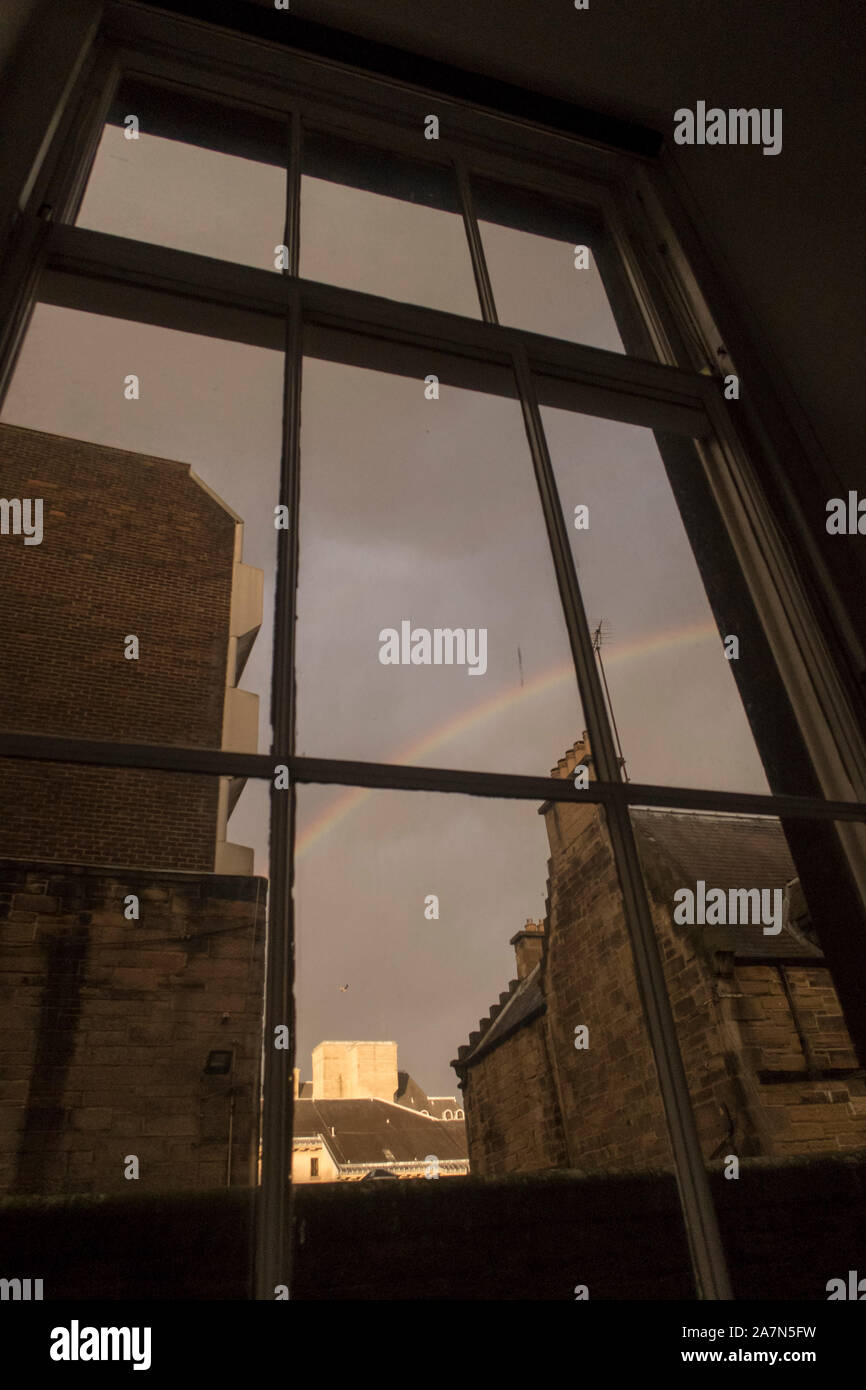 A rainbow seen through the window of an old tenement flat in Edinburgh ...
