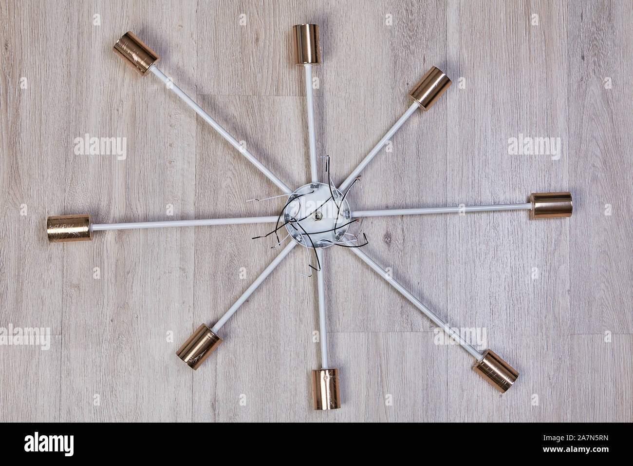 Assembling a modern ceiling chandelier in white painted aluminum ...
