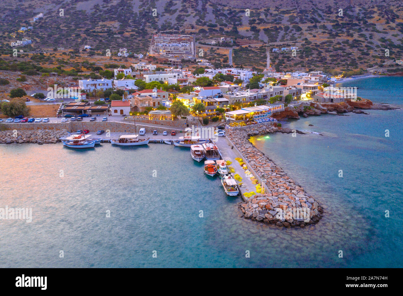 The small harbor of Plaka with traditional fishing boatsnear Elounda ...