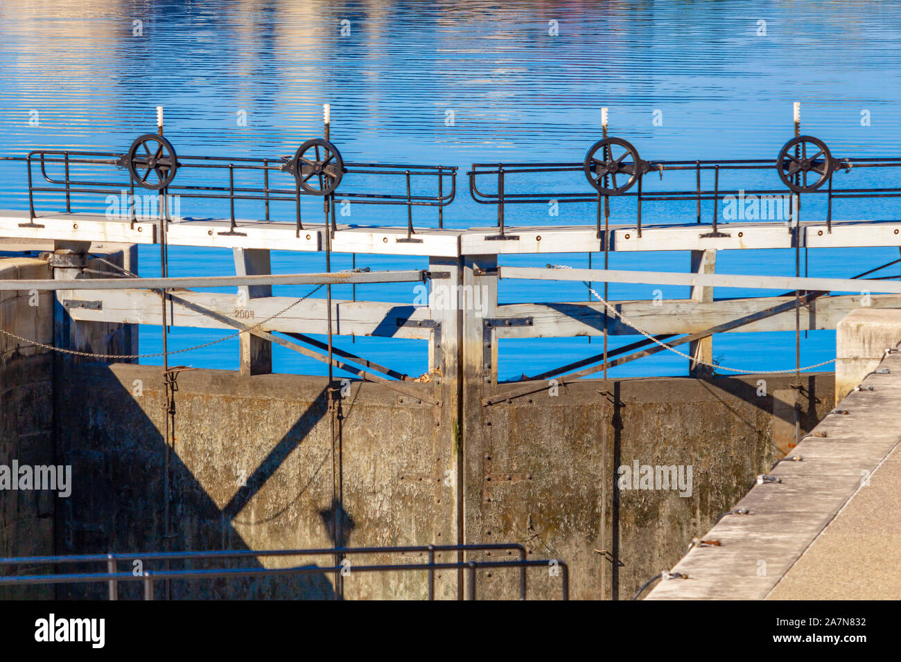 Locks at the mouth of a canal emptying into a river are closed ...
