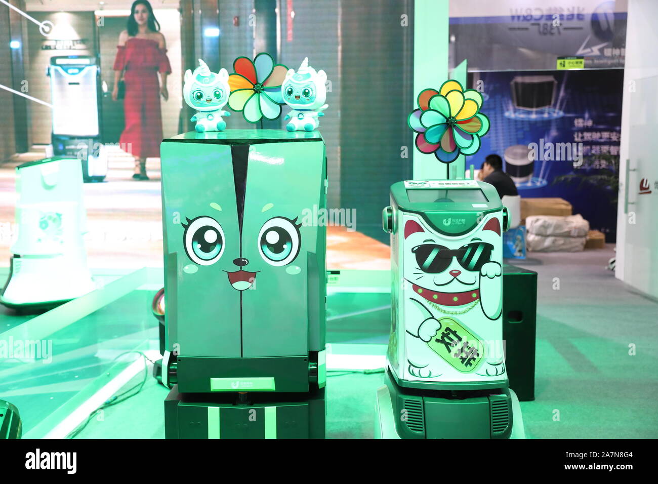Intelligent robots decorated with cartoon patterns are displayed during ...