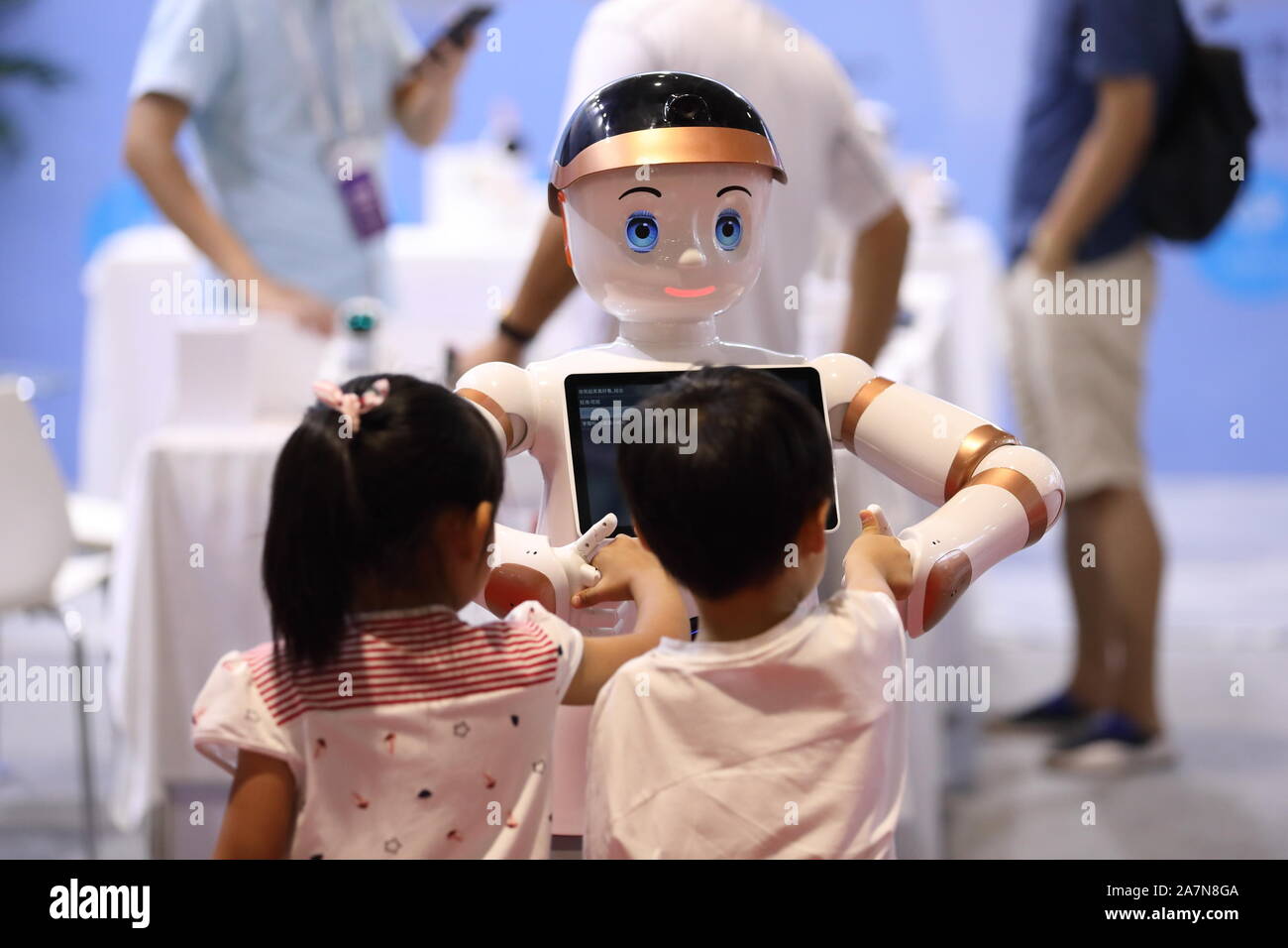 Children interact with an intelligent robot during the 2019 Word Robot ...