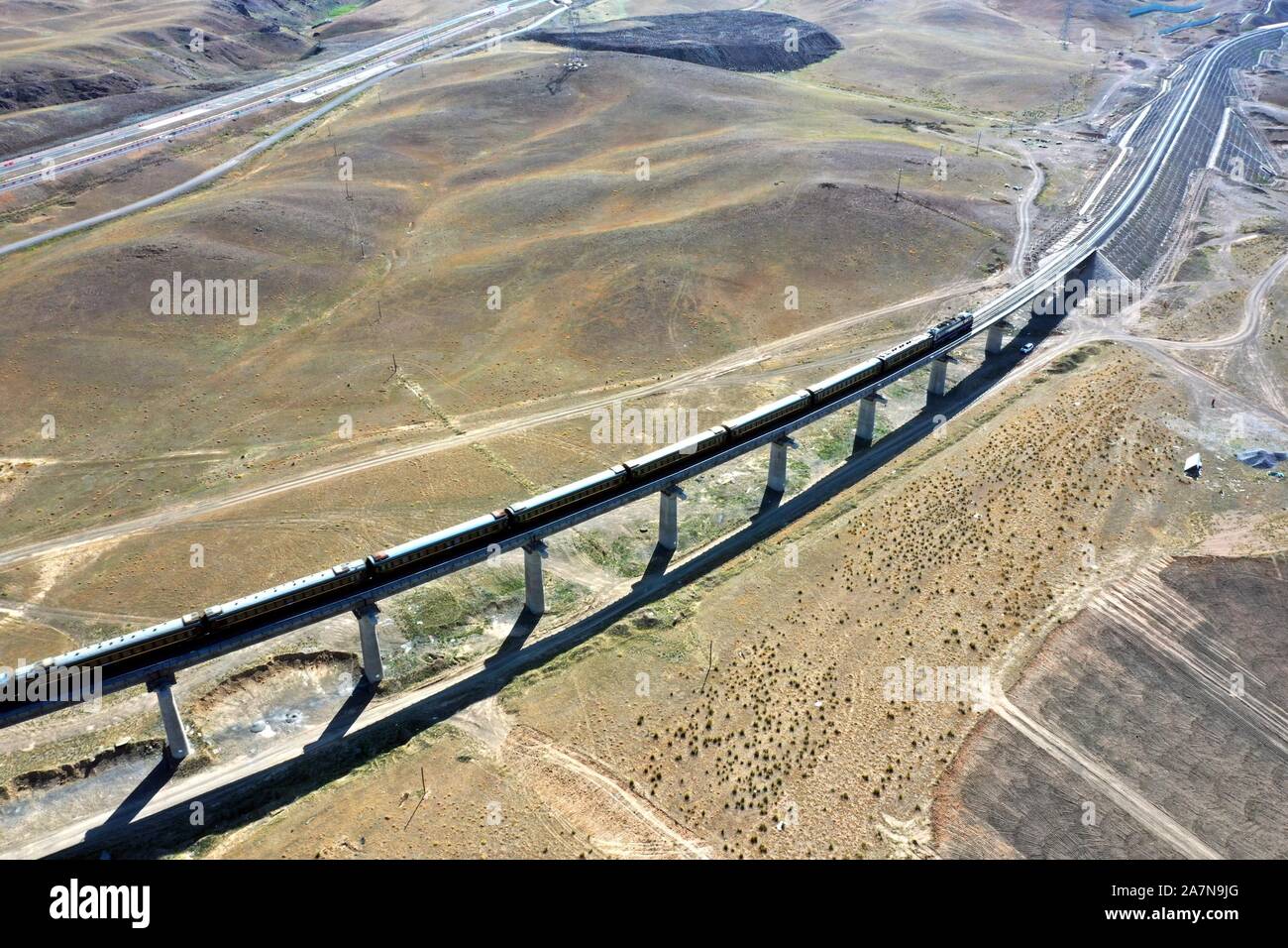 A train runs on the section between Kuytun and Tacheng Prefecture of ...