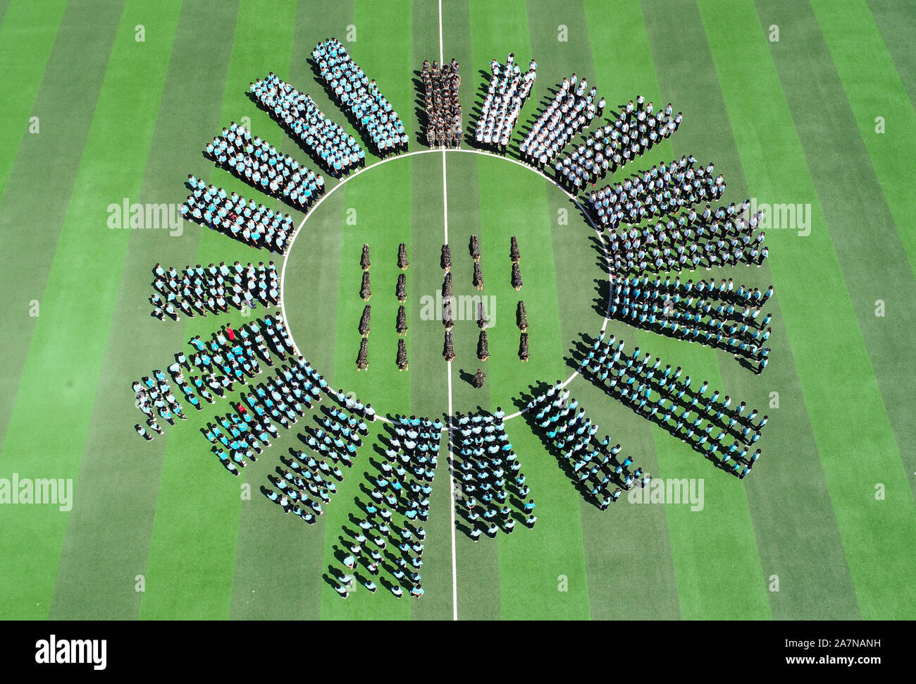 Chinese high school students are lined up to form a military training ...