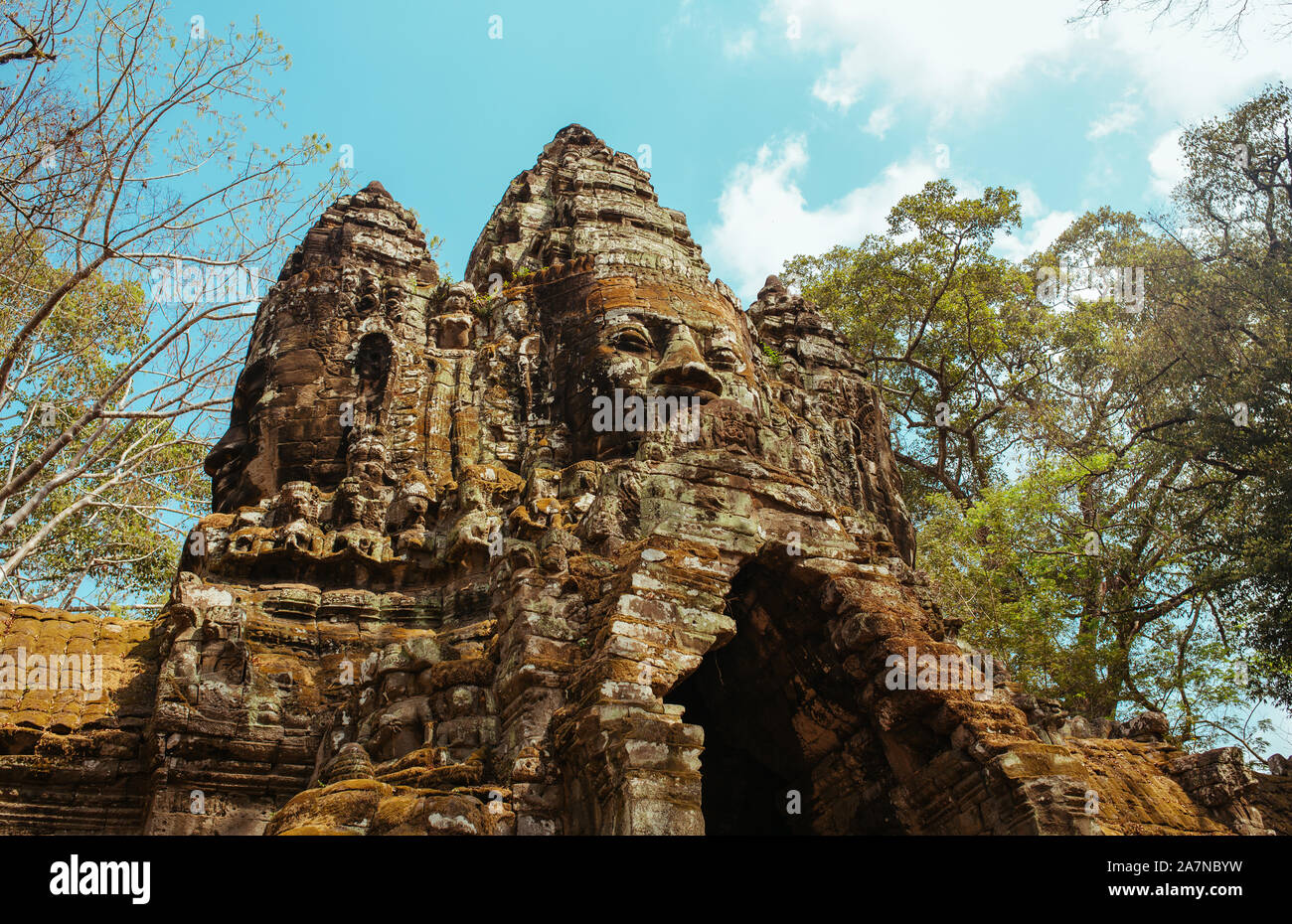 Stone statues of faces in Cambodian Angkor Wat Temple near Siem Reap ...