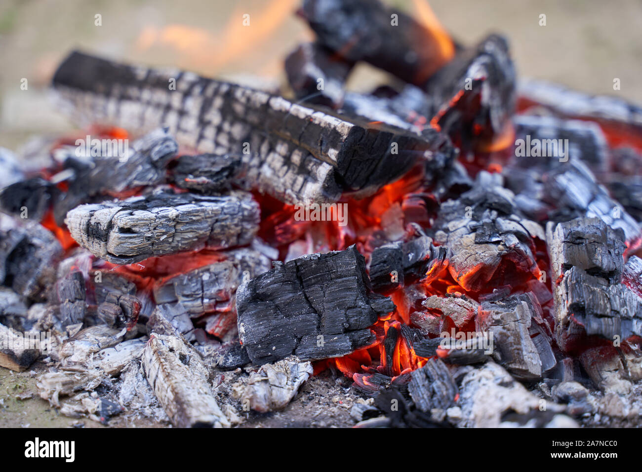 Embers burning for a grill in the countryside Stock Photo - Alamy