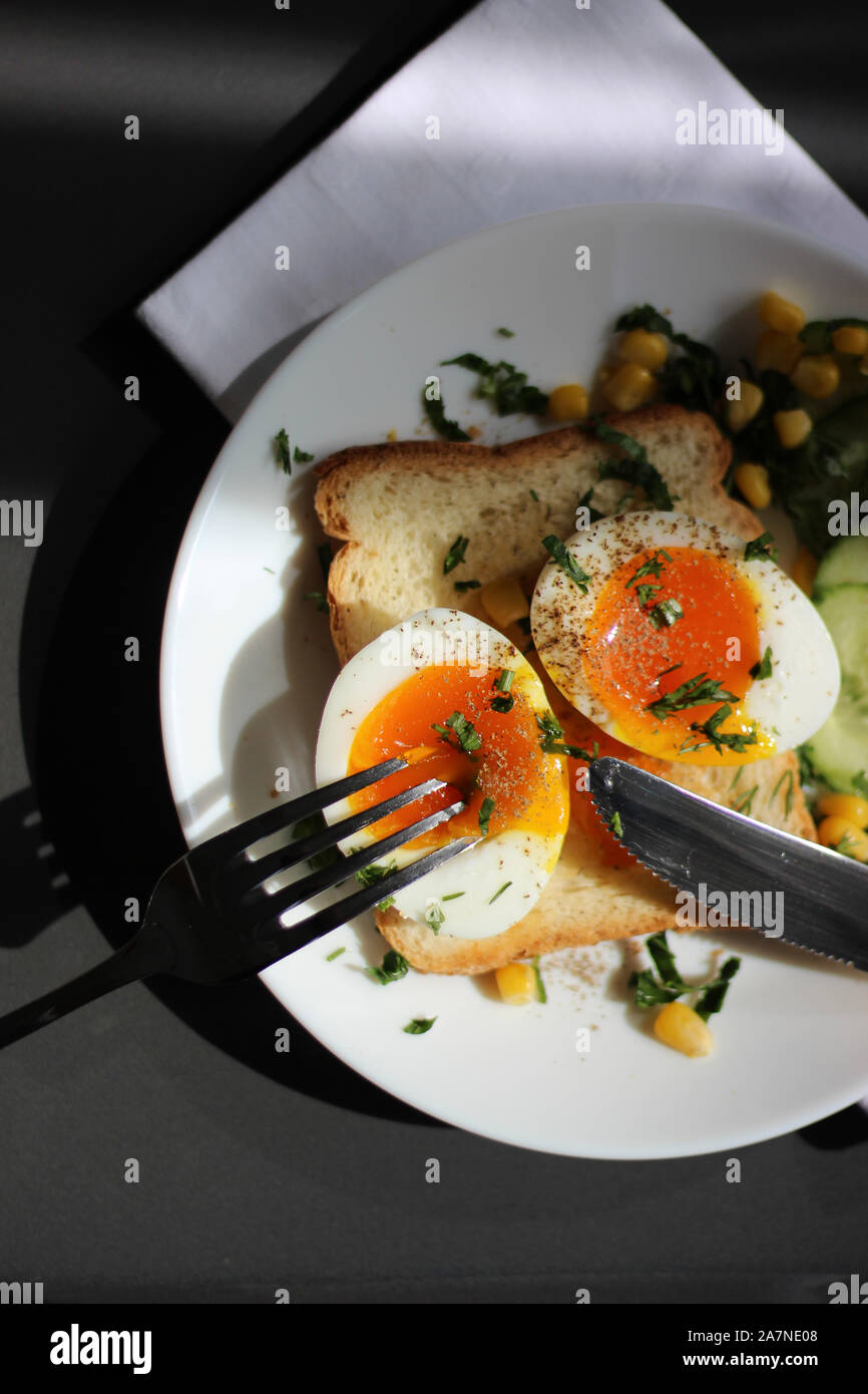 Healthy Breakfast Food Concept. Poached Egg with Liquid Yolk on Bread ...