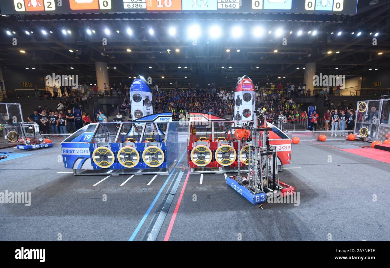 Participants manipulate their robots with a remote during competitions ...
