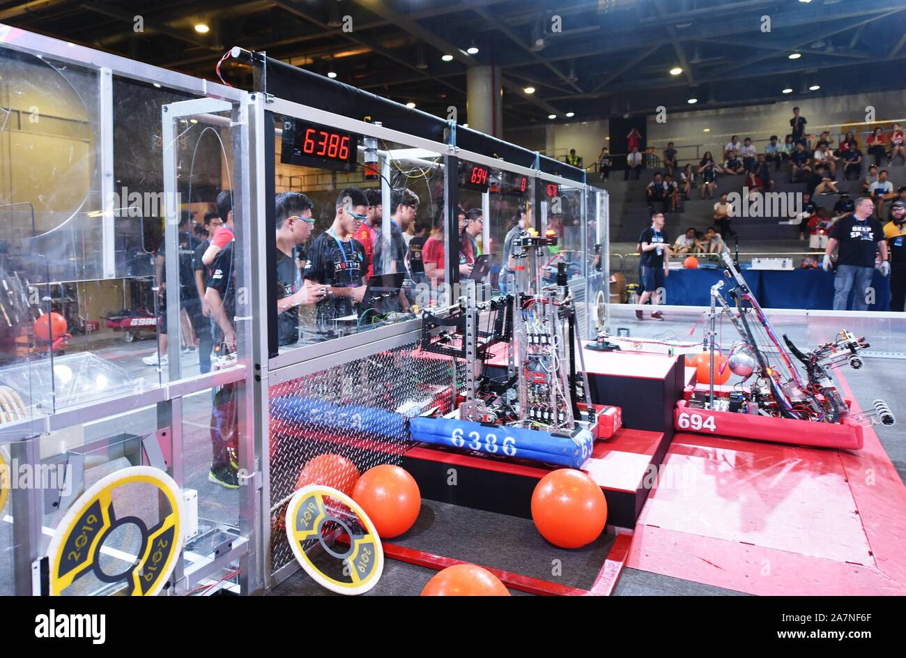 Participants manipulate their robots with a remote during competitions ...