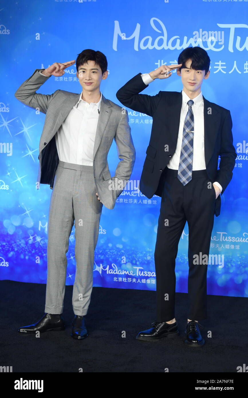 Chinese actor Bai Jingting, left, poses with a wax figure of him during ...
