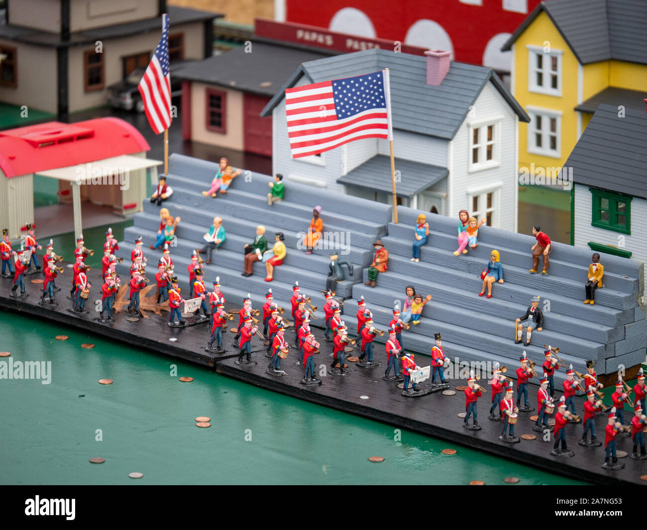 Miniature figurines marching band in parade with on lookers with US ...