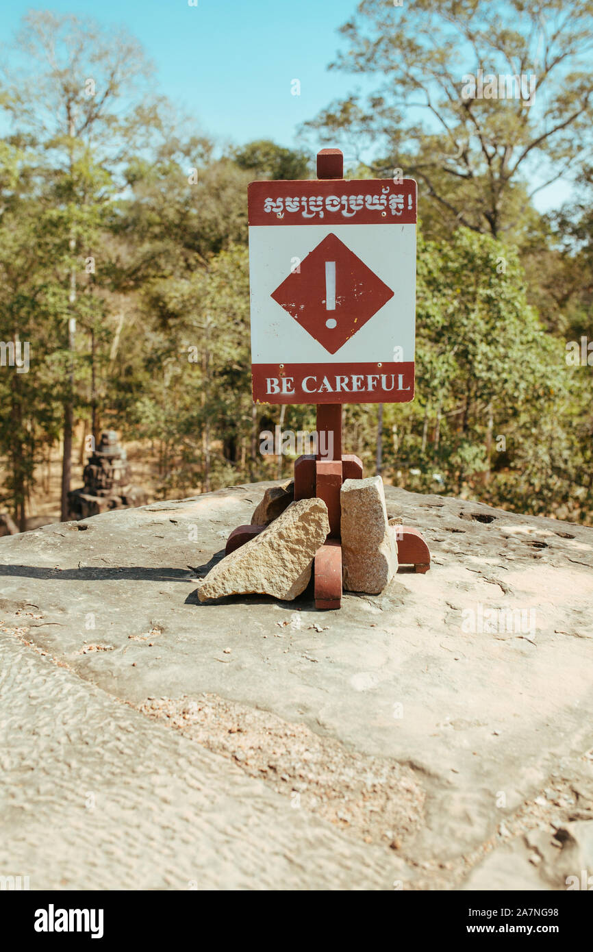 Be Careful Warning sign in Angkor Wat Temple Stock Photo - Alamy