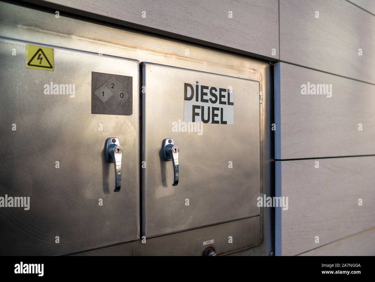 Diesel fuel sign on refueling station closed shut steel doors outside ...