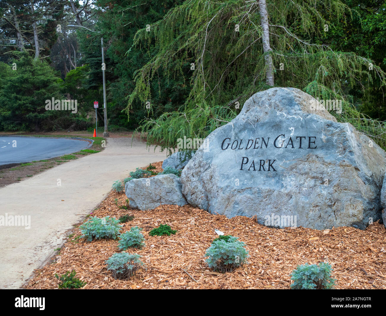 Golden Gate Park entrance sign etched into rock leading to street Stock ...
