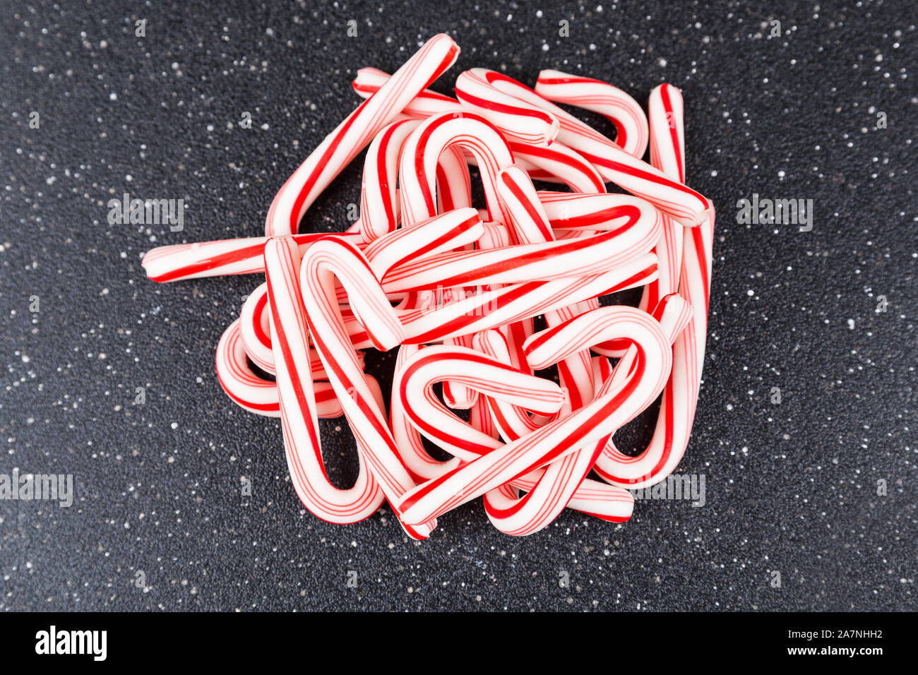 Red and white striped small peppermint flavored candy canes Stock Photo ...