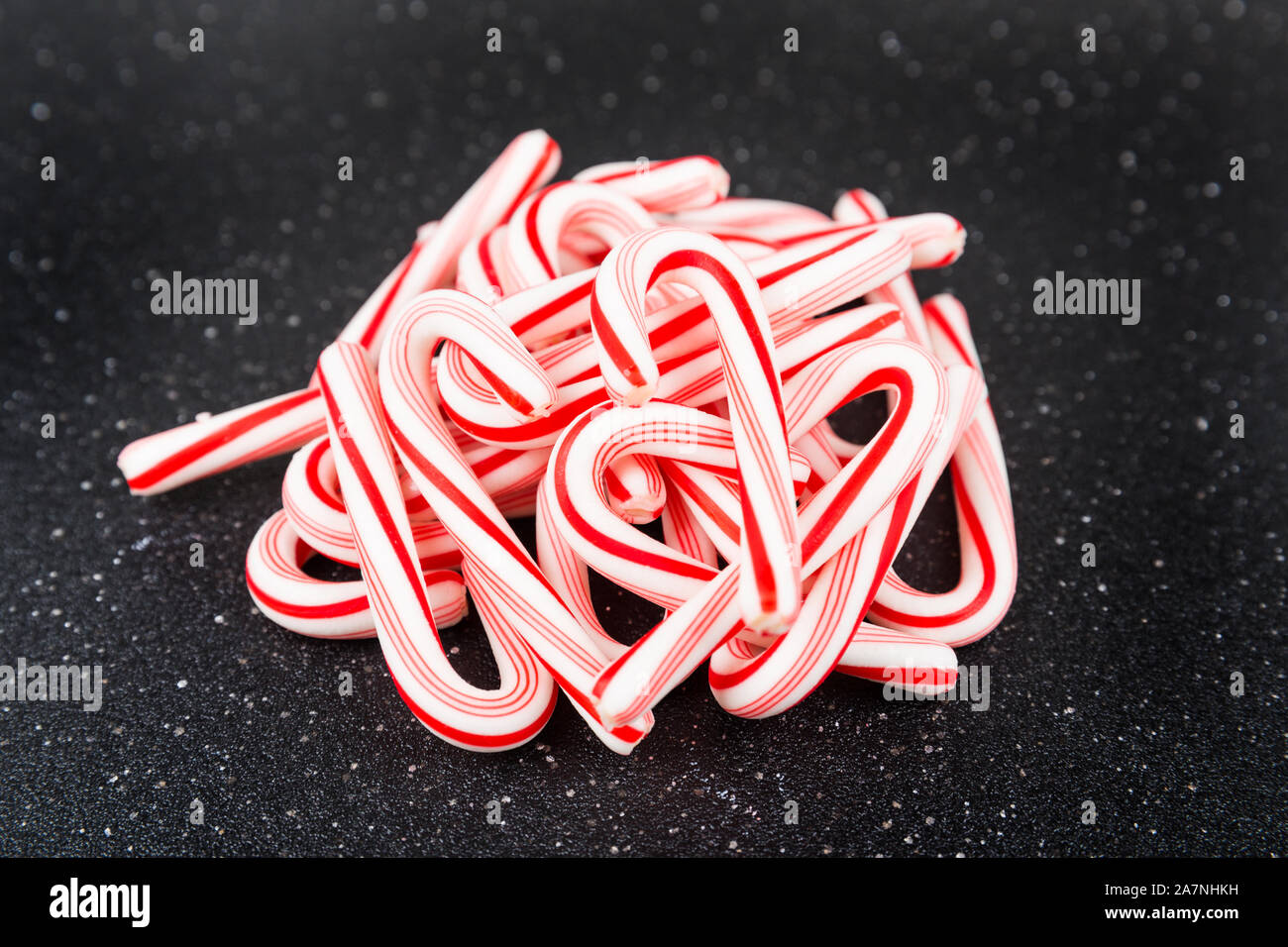 Red and white striped small peppermint flavored candy canes Stock Photo ...