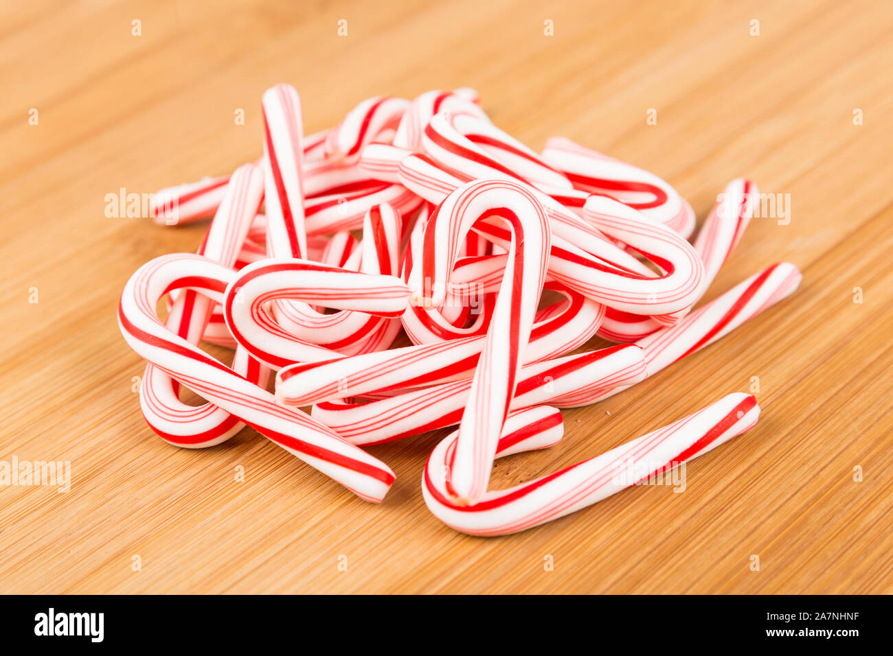 Red and white striped small peppermint flavored candy canes Stock Photo ...