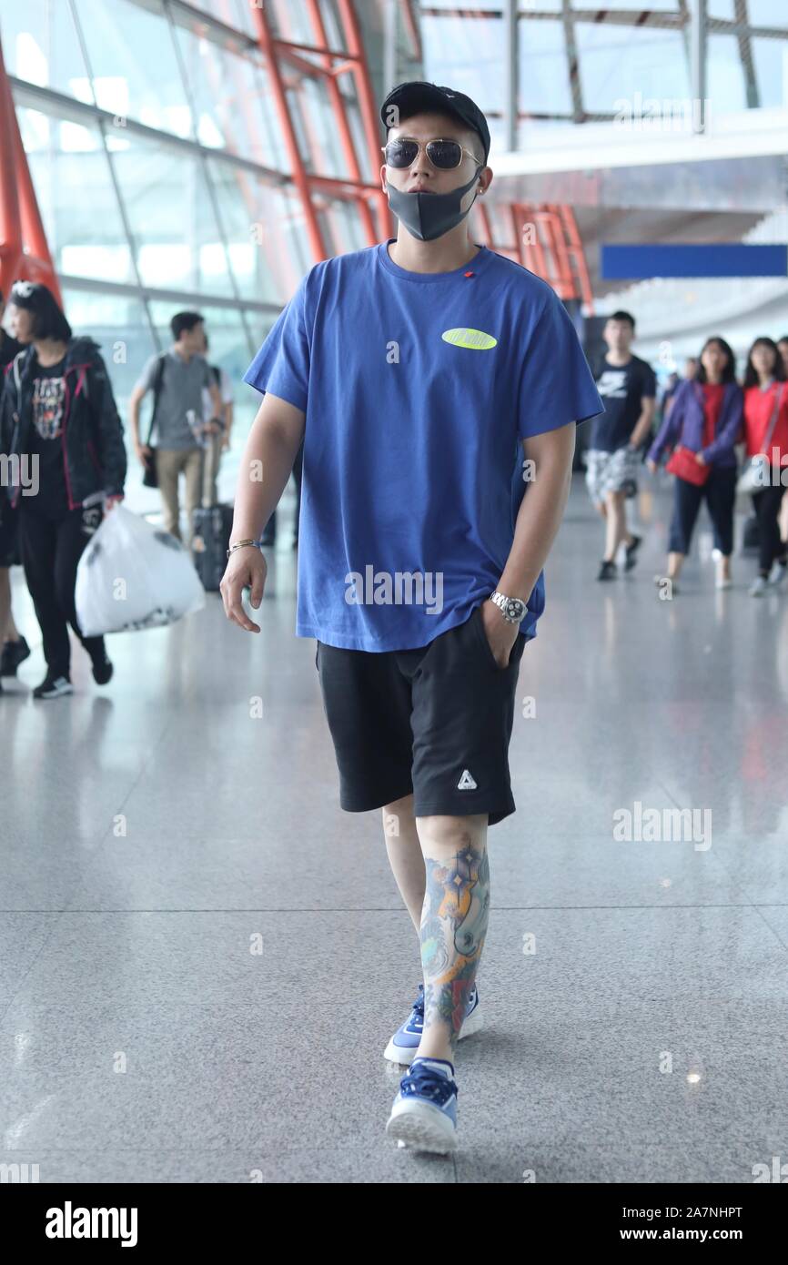 Chinese actor and singer Ohu Ou Hao arrives at the Beijing Capital ...
