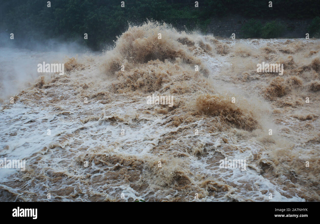 Floodwater gushes out of a reservoir as the Typhoon Lekima, the 9th ...