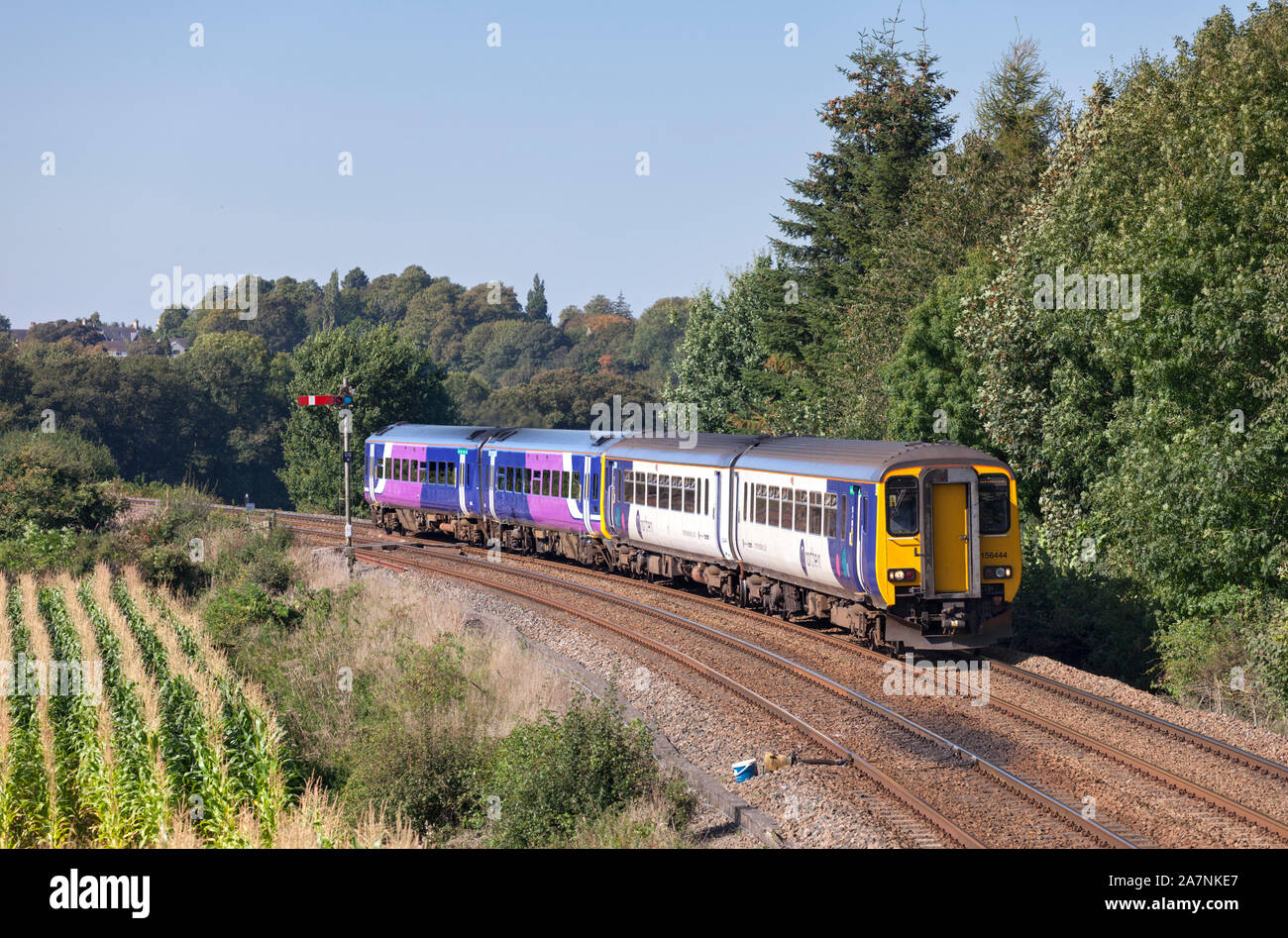 Arriva Northern rail class 156 + class 158 sprinter trains passing the semaphore home signal at ...